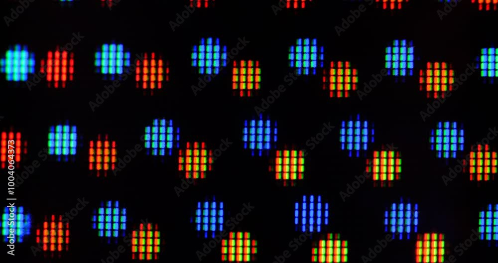 Extreme macro view of 4K LED matrix red, blue, and green sub-pixels ...