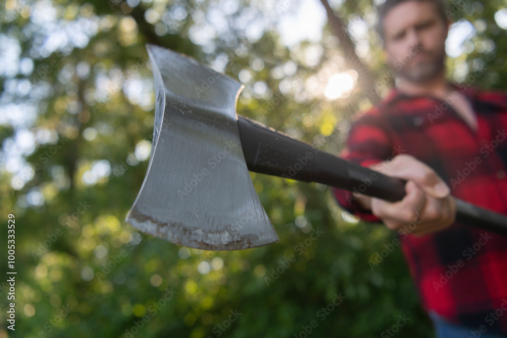 Axe in man hand chopping wood. Cutting wood. Sharp blade. Brutality and ...