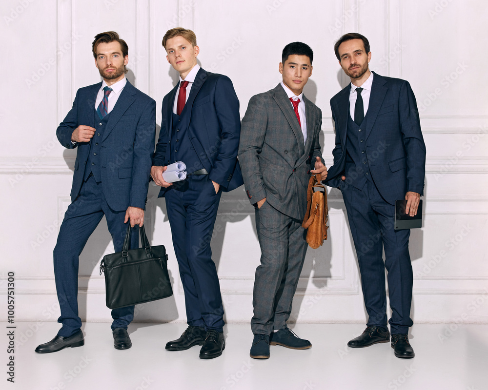 Formal group portrait, strong men presenting elegance and teamwork ...