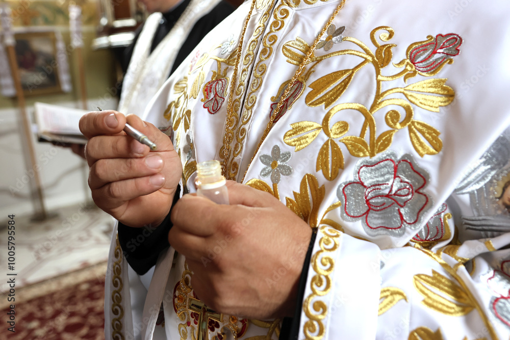 When performing the rite of baptism and anointing, priests use church ...