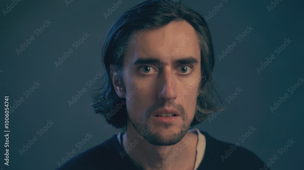 a young man with long hair, large expressive eyes, European appearance ...
