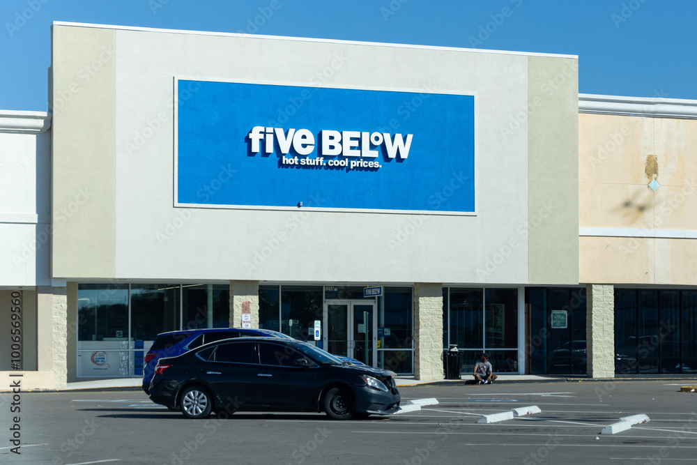 Five Below store exterior with a blue sign and slogan "hot stuff, cool ...