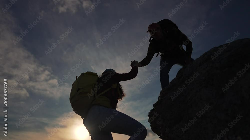 Man helps woman climb mountain. Family travel adventure showcasing ...