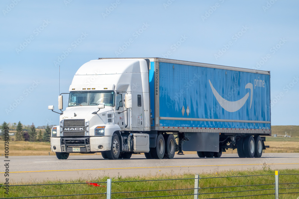 Calgary, Alberta, Canada. Oct 2, 2024. A white semi truck hauls a large ...