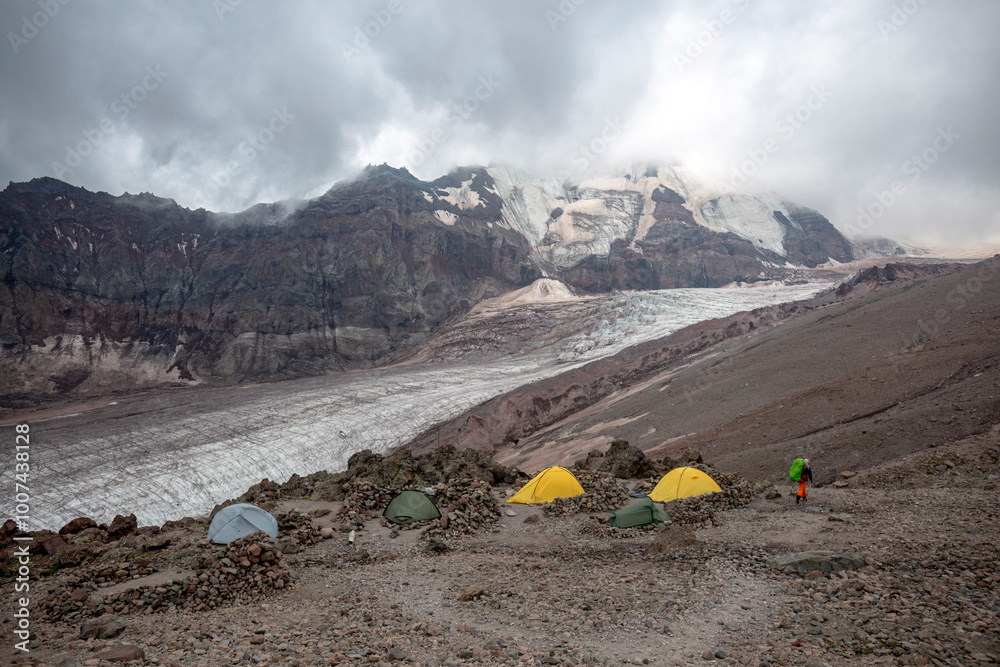 Vibrant Base Camp: A colorful array of tents sprawls across the rocky ...