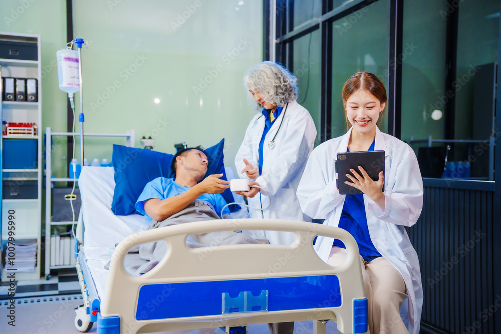A middle-aged man lies bedridden on hospital bed, closely monitored by ...