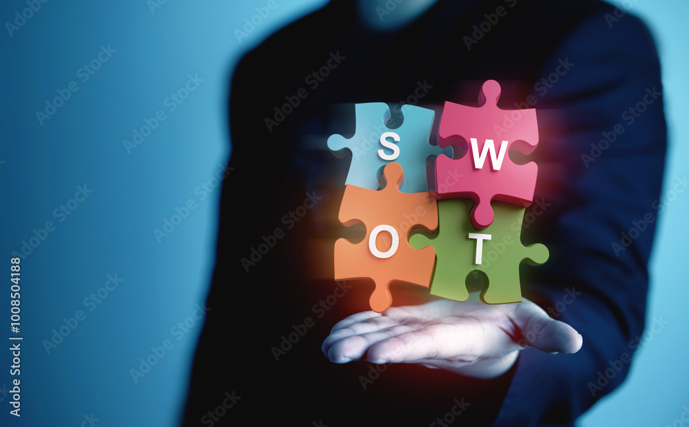 Businessman showing SWOT jigsaw puzzle. concepts of business and ...