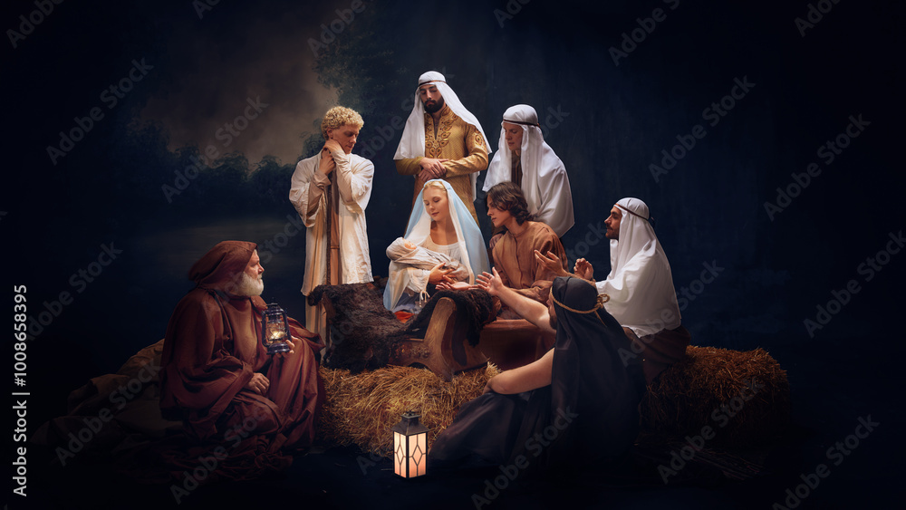 Nativity setup with newborn child, Jesus, cradled by Mary. Shepherd ...