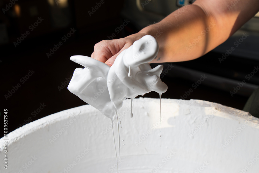 The hands of a craftswoman elaborating a traditional and ancestral ...