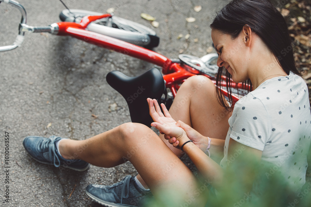 Young caucasian woman riding a red bicycle, captured moments before and ...