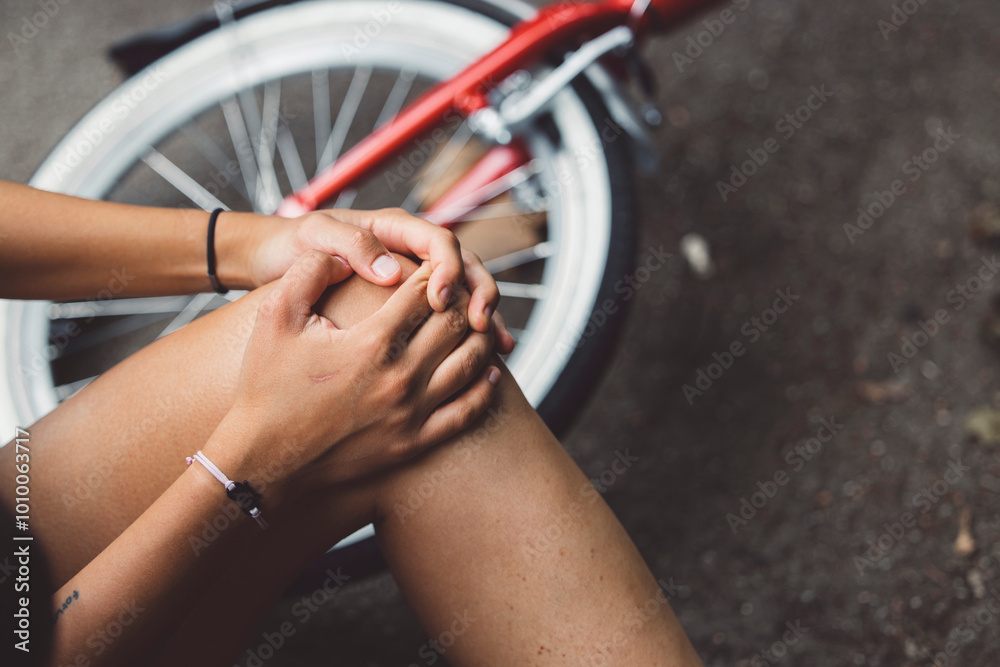 Young caucasian woman riding a red bicycle, captured moments before and ...