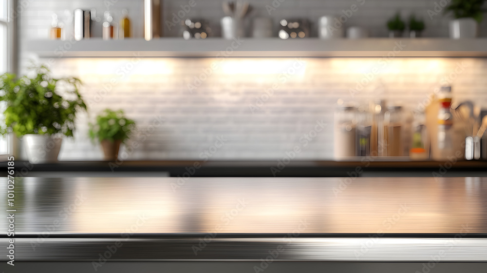 Smooth silver stainless steel table, counter with a blurred kitchen and ...