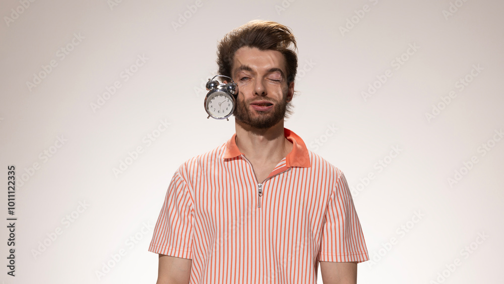 Alarm clock smashes into man's cheek, his face squished from force ...