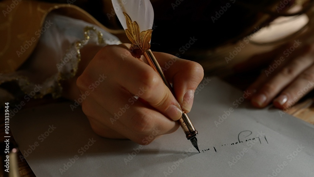Antique young woman in renaissance dress sitting at table and writing ...