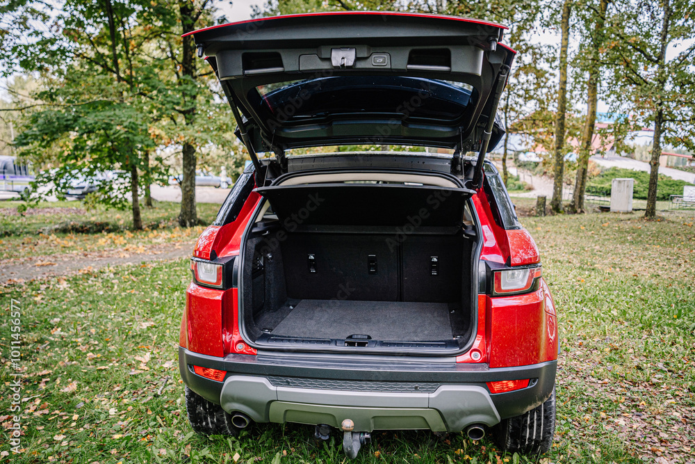 Open trunk of a red Range Rover SUV, showcasing spacious cargo space ...