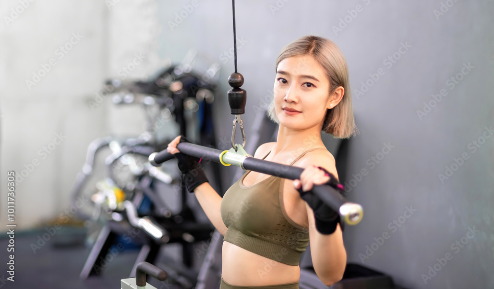 fitness asian woman pulling workout system. attractive female exerciser ...