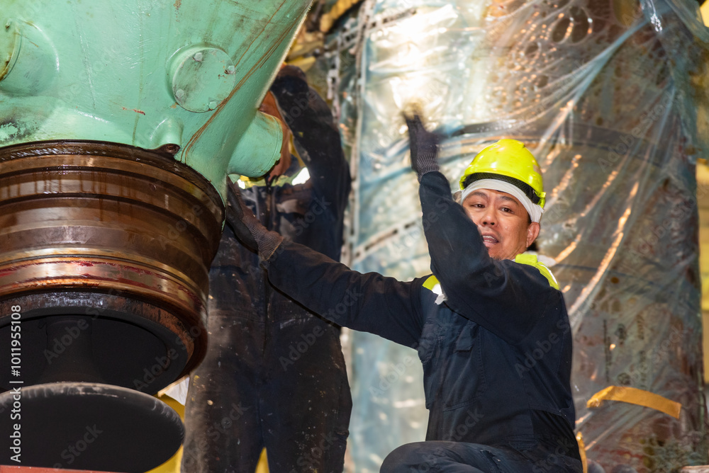 A member of the engine crew is captured in the ship's engine room ...