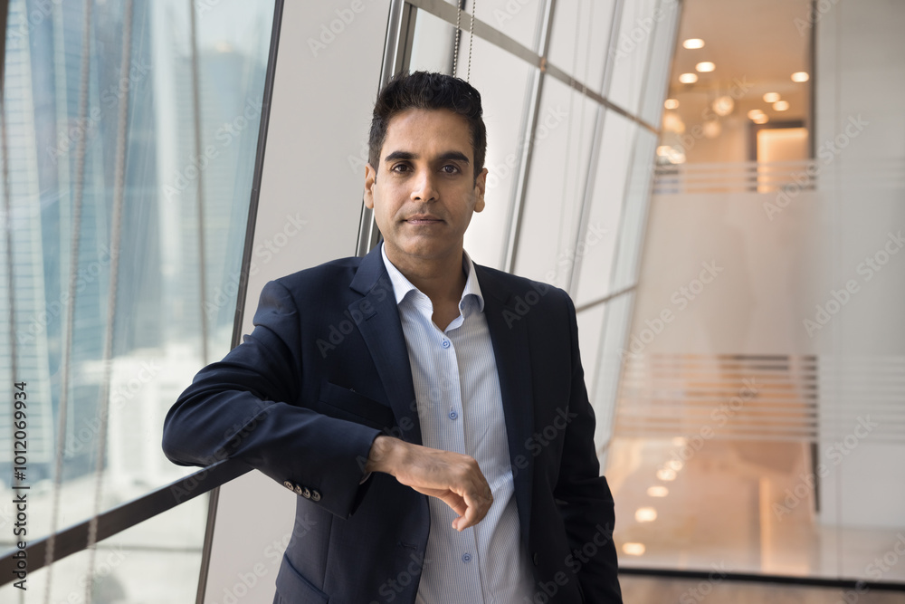Serious confident middle aged Indian business leader man in formal ...