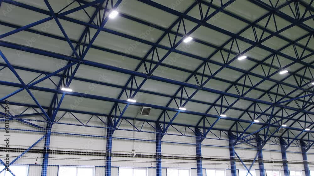 Indoor soccer stadium reinforced along perimeter of system of iron ...