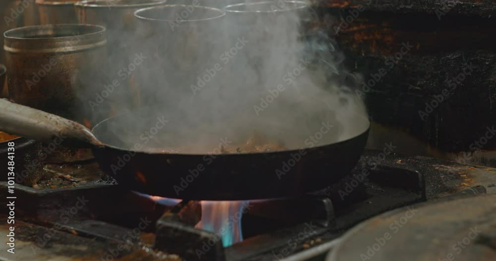 Man cooking street food Biryani on a busy street. Slow motion Biryani ...
