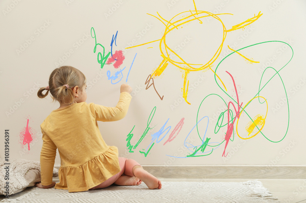 Poster Little child drawing on white wall, back view – Wall Art | UkPosters