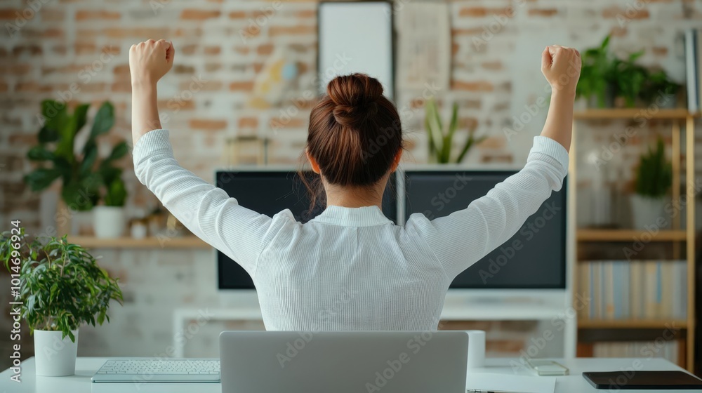 Person standing up from a desk, stretching their arms and back, trying ...