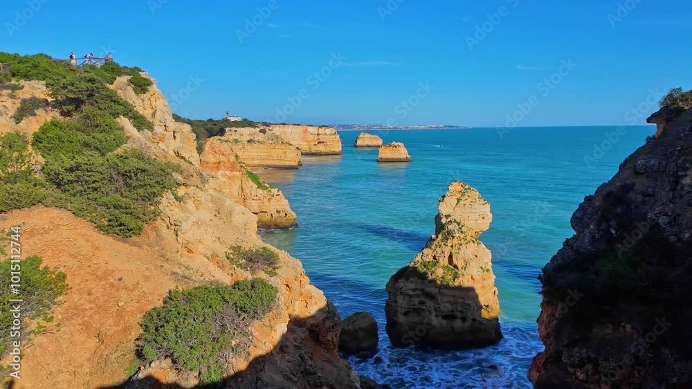 Praia da Marinha Beach among rock islets and cliffs seen from Seven ...