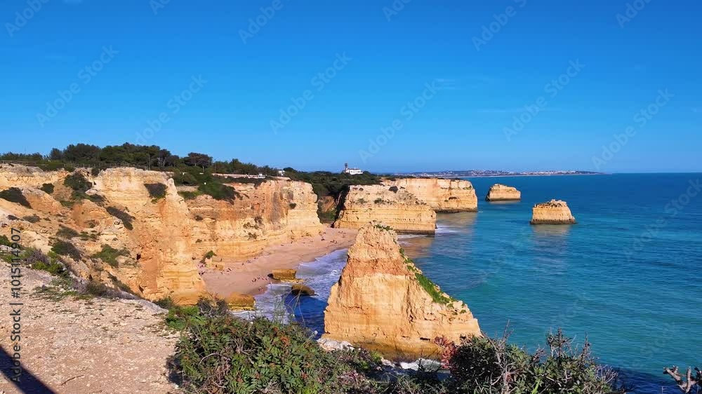 Praia da Marinha Beach among rock islets and cliffs seen from Seven ...