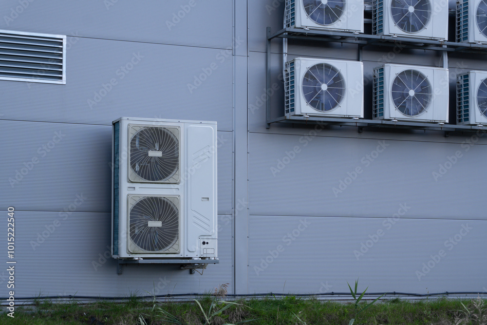 Close-up of outdoor air conditioning units on the exterior of a ...