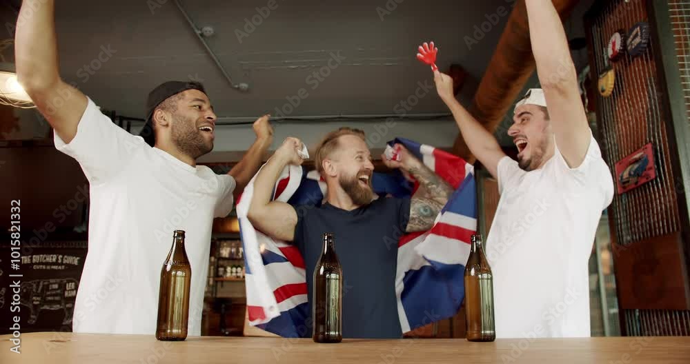 Soccer fans celebrating victory of team in sports bar. Loyal football ...