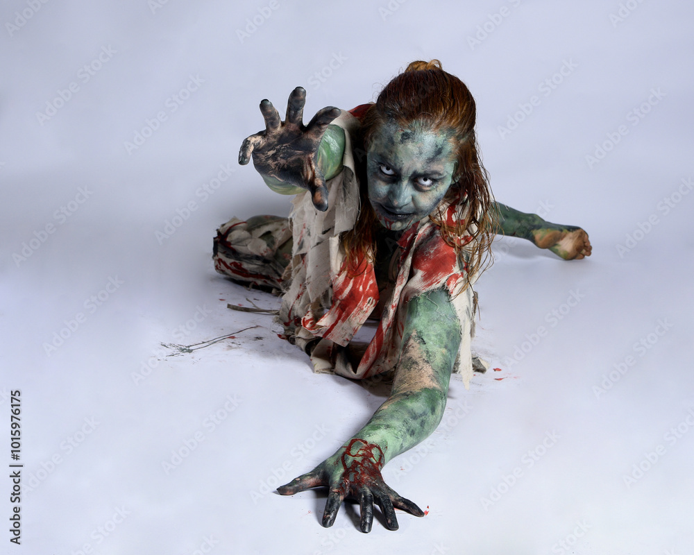 portrait of scary female model wearing spooky halloween costume, ripped ...