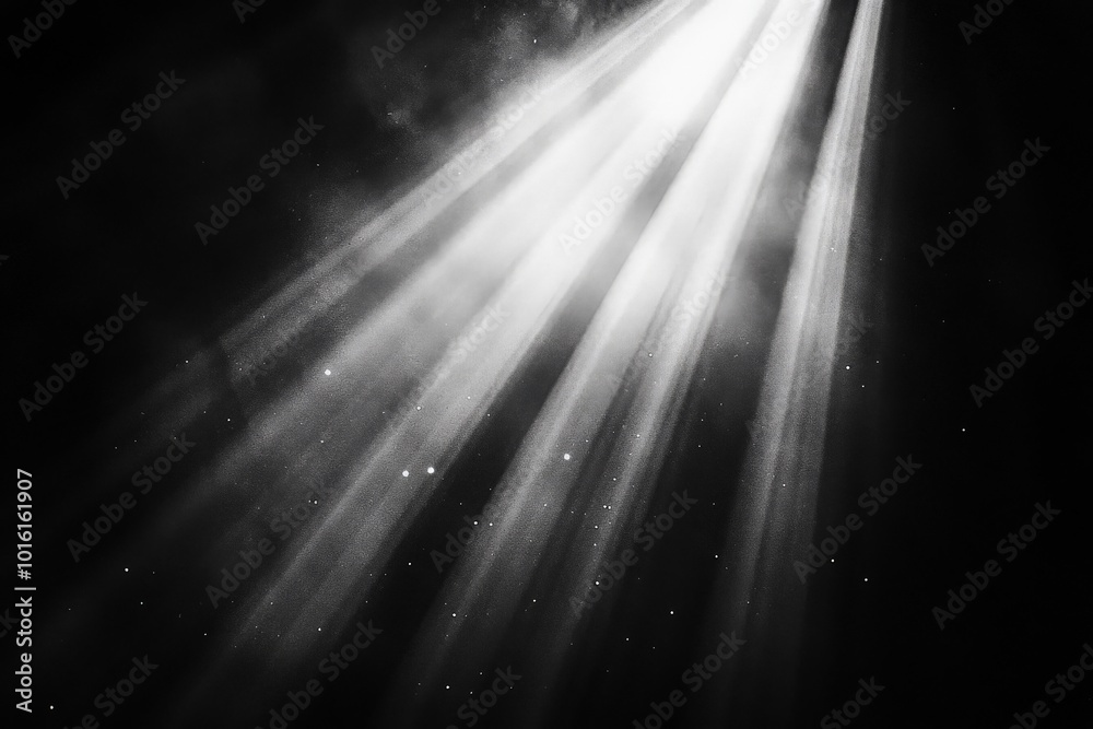 An awe-inspiring capture of monochrome light beams streaming through ...