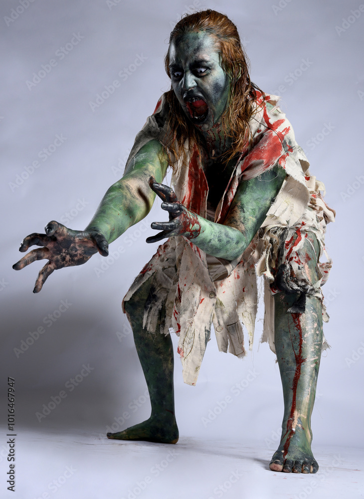 portrait of scary female model wearing spooky halloween costume, ripped ...