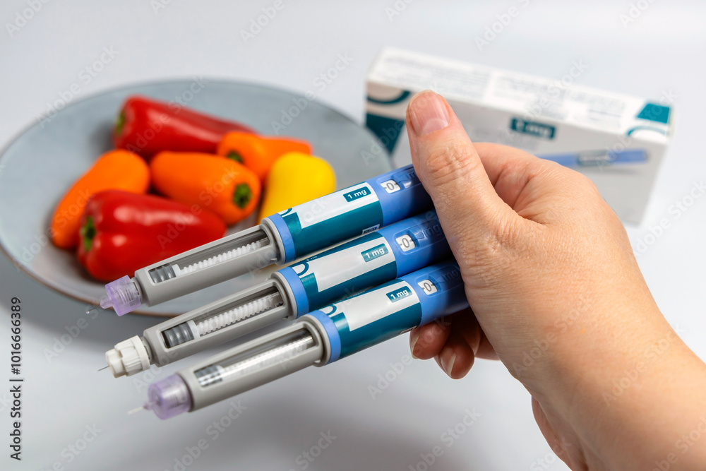 Hands holding Ozempic Insulin injection pen for diabetics and weight ...