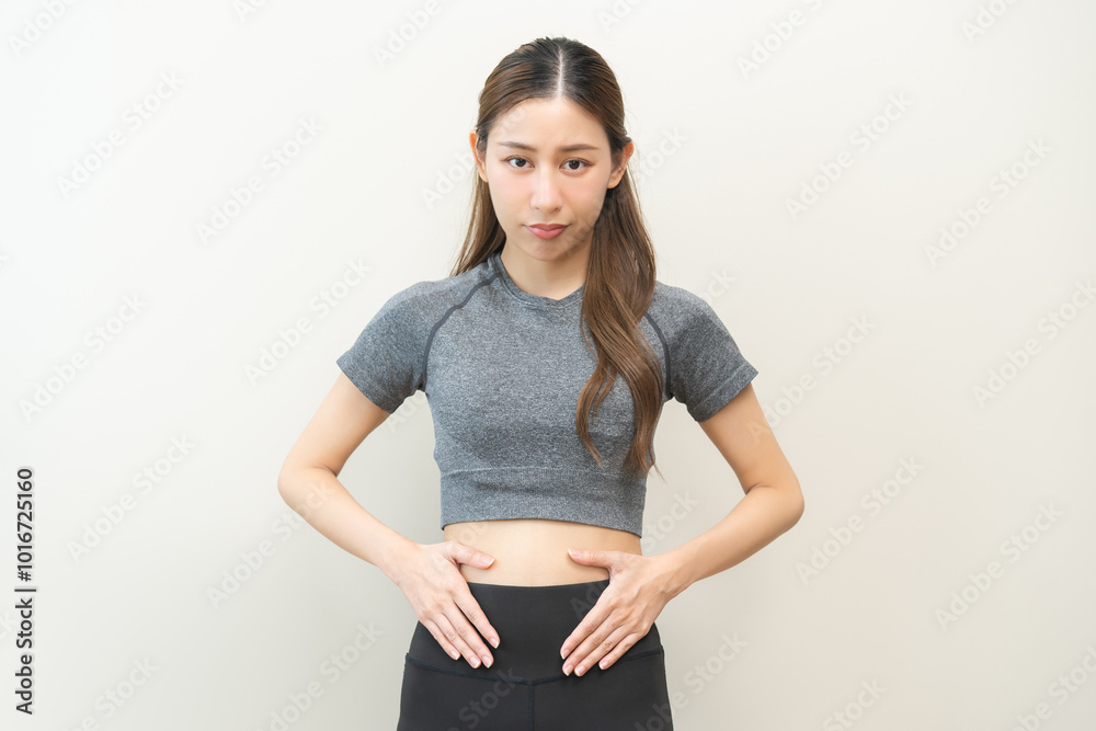 Excess weight gain, overweight asian young woman touching stomach ...