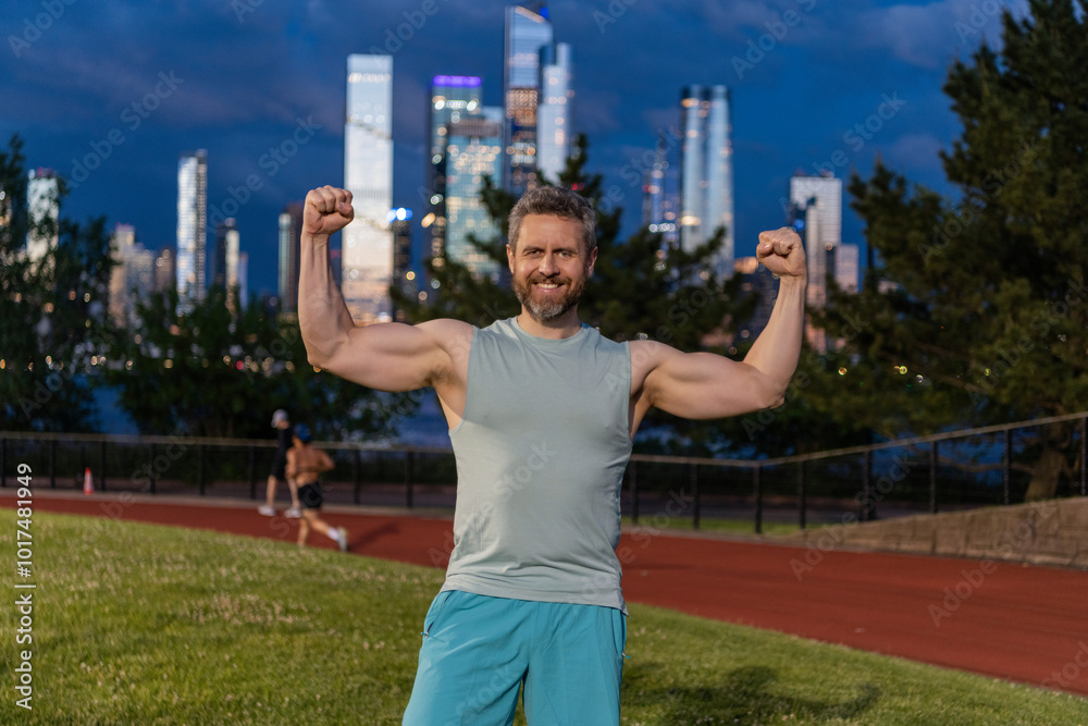 Biceps concept. Athlete show biceps and triceps. Man flex arms with ...