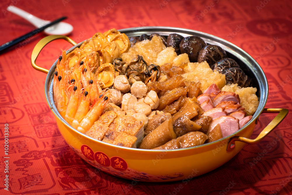 chinese traditional Peng cai with luxury seafood, meat, vegetable and premium sauce in hot pot ...