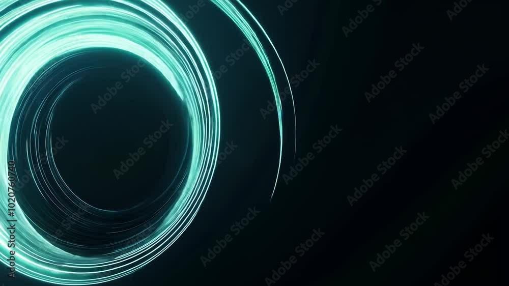 Turquoise light is forming concentric circles rotating on a black ...