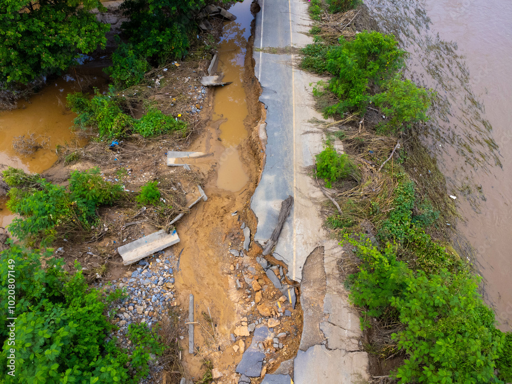 Landslides caused by heavy rains have caused the asphalt roads to crack ...