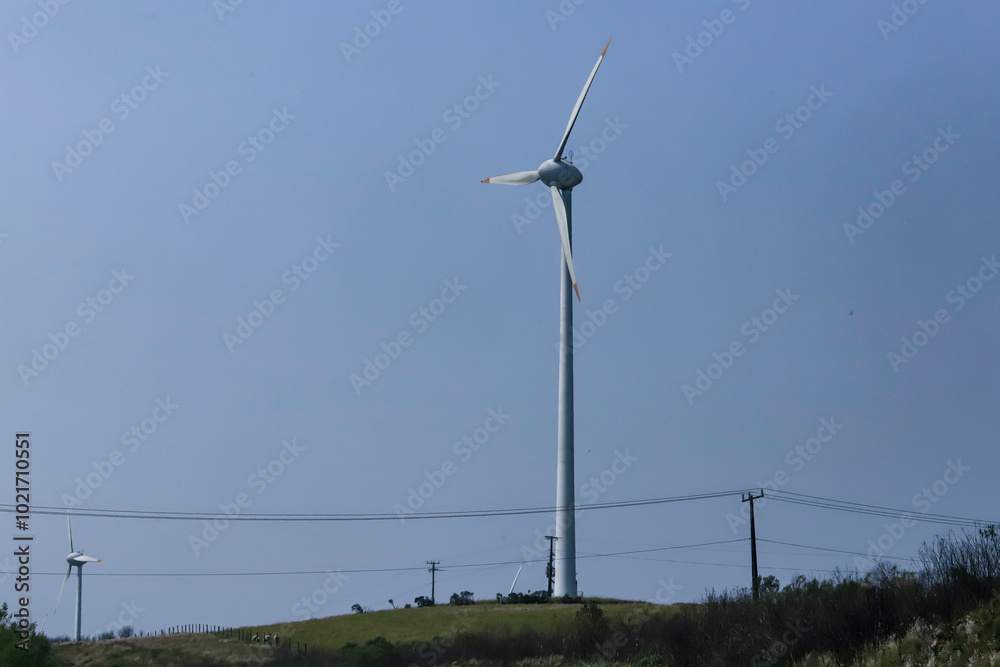 Wind turbine on a cloudless blue sky day. The system of capturing ...