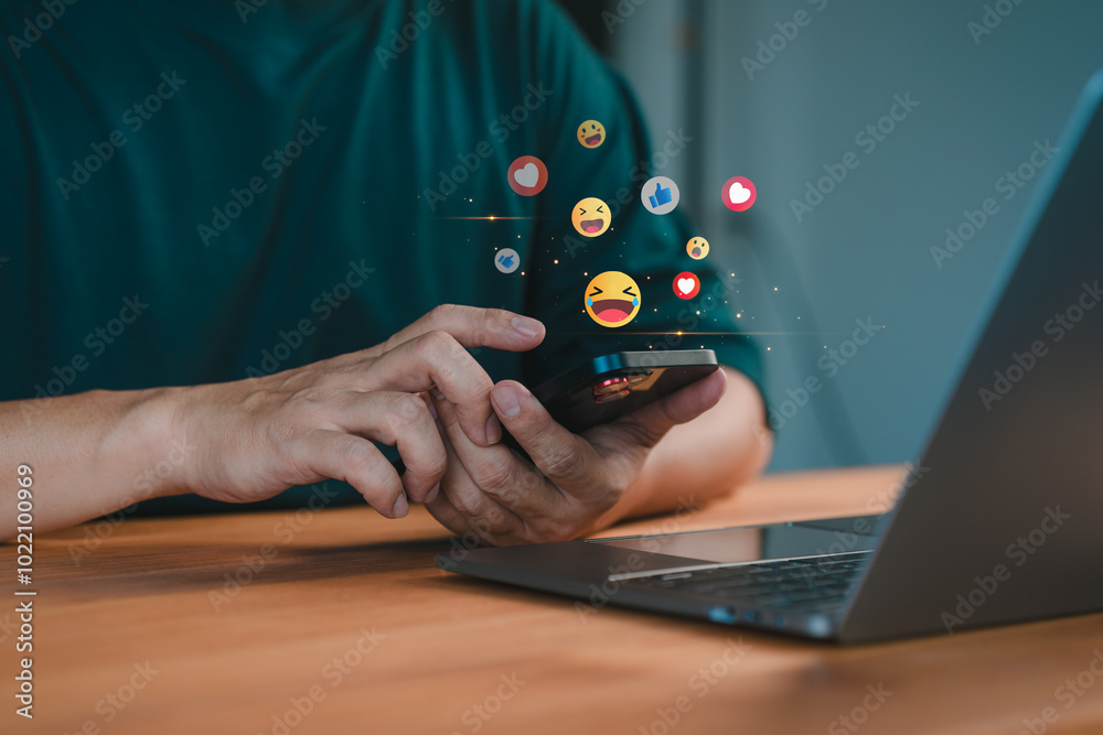 Person using a smartphone with various social media reactions, floating ...