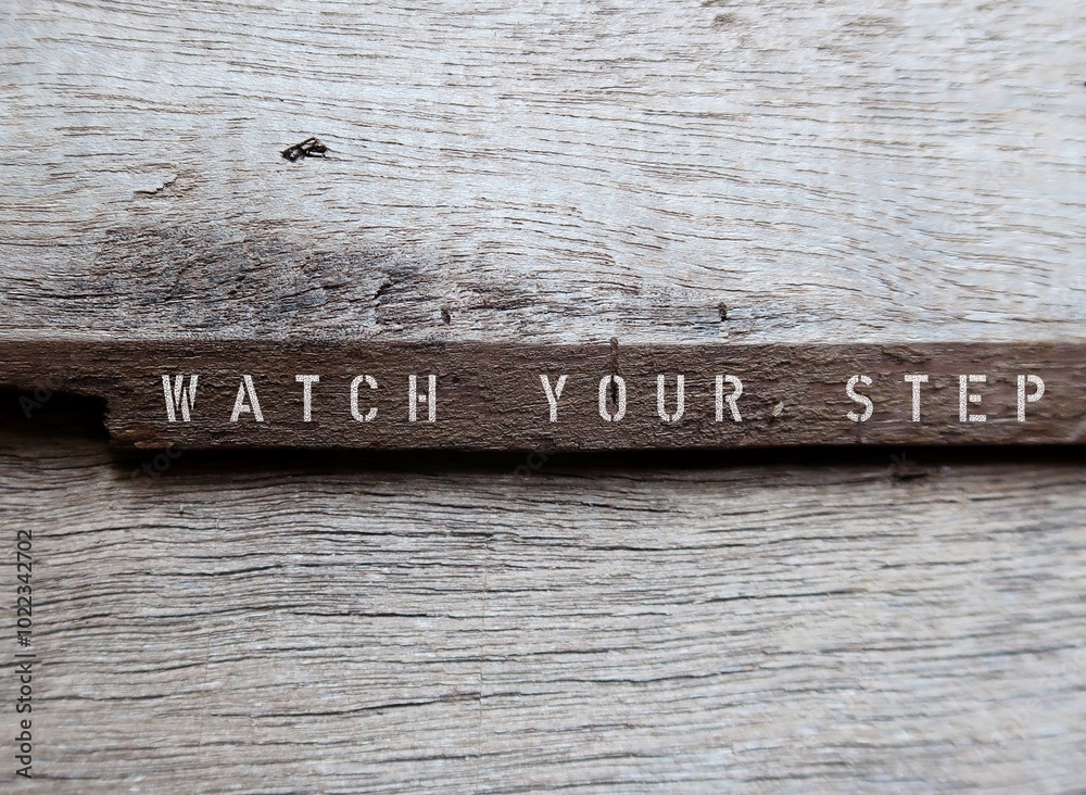 Poster Wood steps with text inscription WATCH YOUR STEP , meaning to be ...