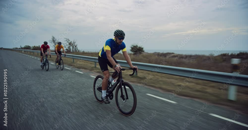 Three Cyclists Ride Together Along the Road, Bicycles Gliding Over the ...