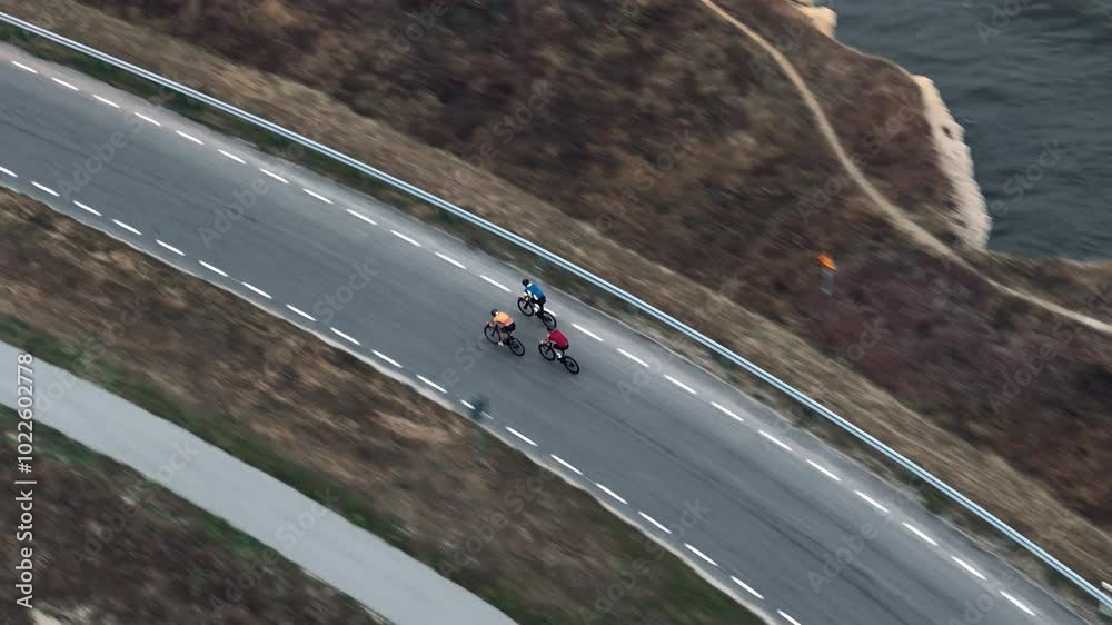 Aerial Drone Footage of a Cycling Team Pedaling Together on a Scenic ...