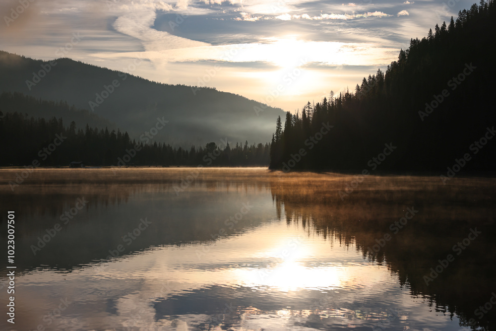 the steaming lightning lake in British Columbia in the early morning ...