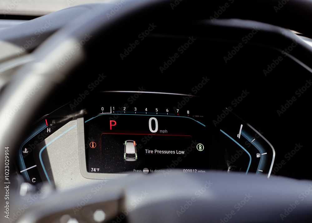 Side view tire pressure low indicator displays on instrument panel of ...