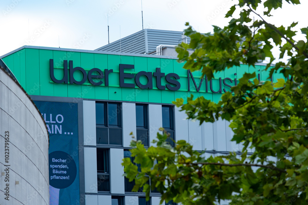Uber Eats Music Hall Advertising logo on modern building facade, fusion ...
