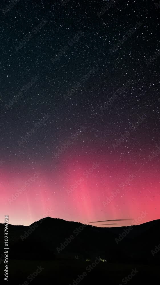 Vertical video of red aurora borealis motion in starry night sky in ...