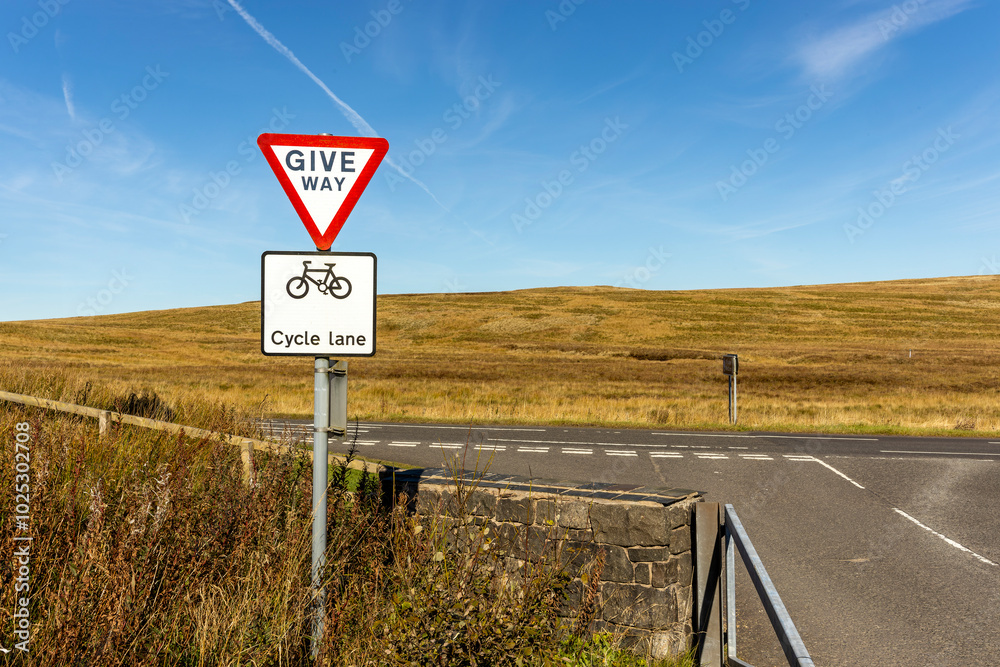 Give Way and Cycle Lane road signs at road junction on rural ...