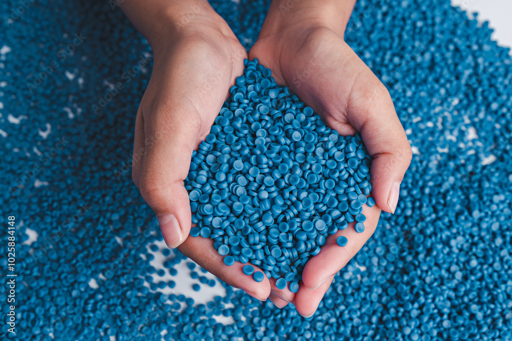 Blue plastic grain, plastic polymer granules,hand hold Polymer pellets ...